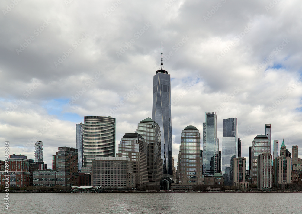 downtown manhattan skyline with dramatic cloudy sky (hudson river ...