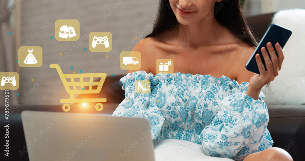 Elegant customer wearing blue dress controlling device choosing online ...