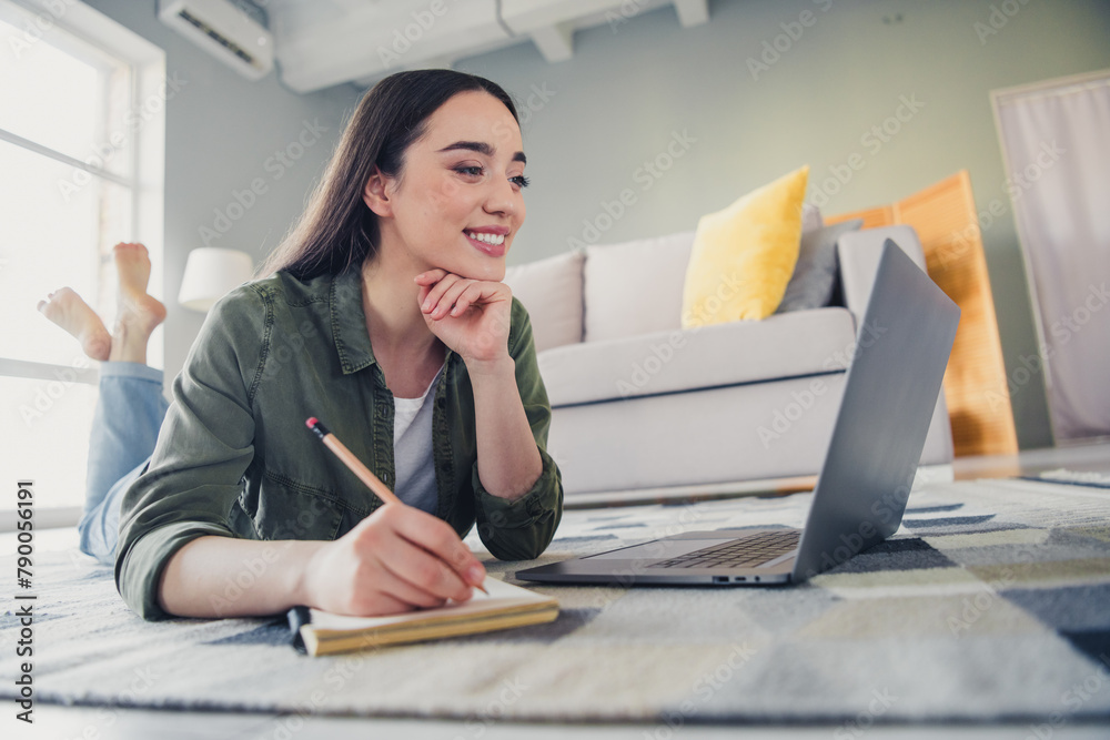 Full size photo of pretty young woman lay floor notepad laptop wear ...