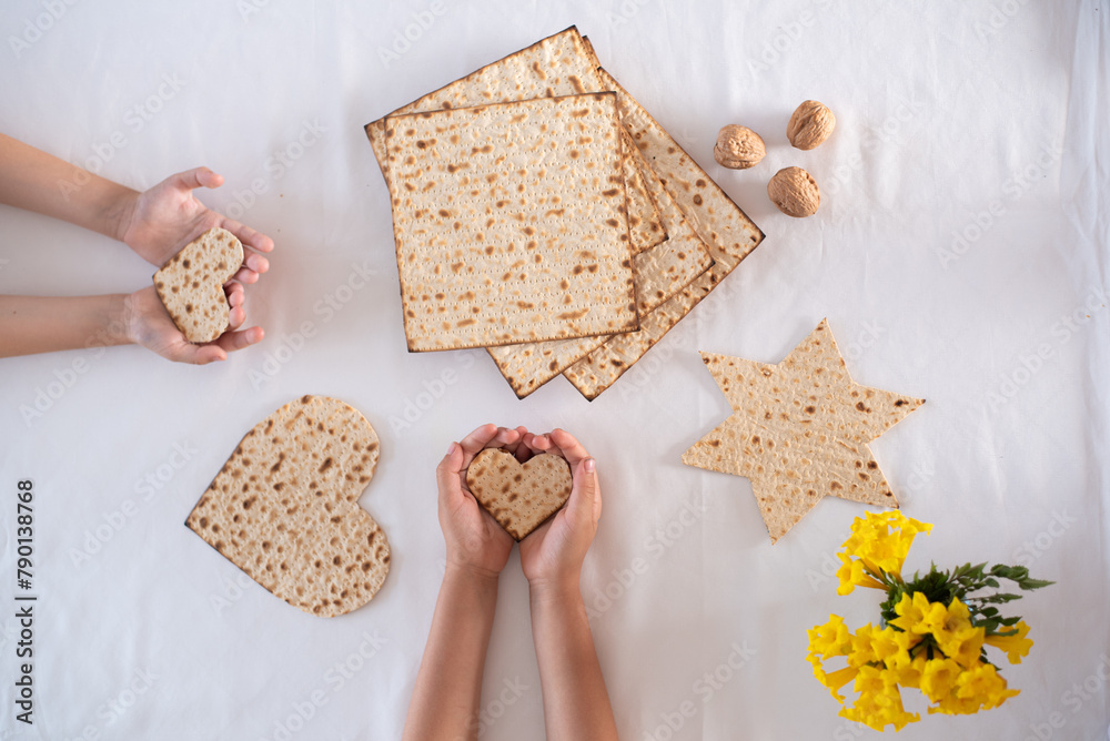 Children hands hold Matzah shape of heart. Traditional of Jewish ...