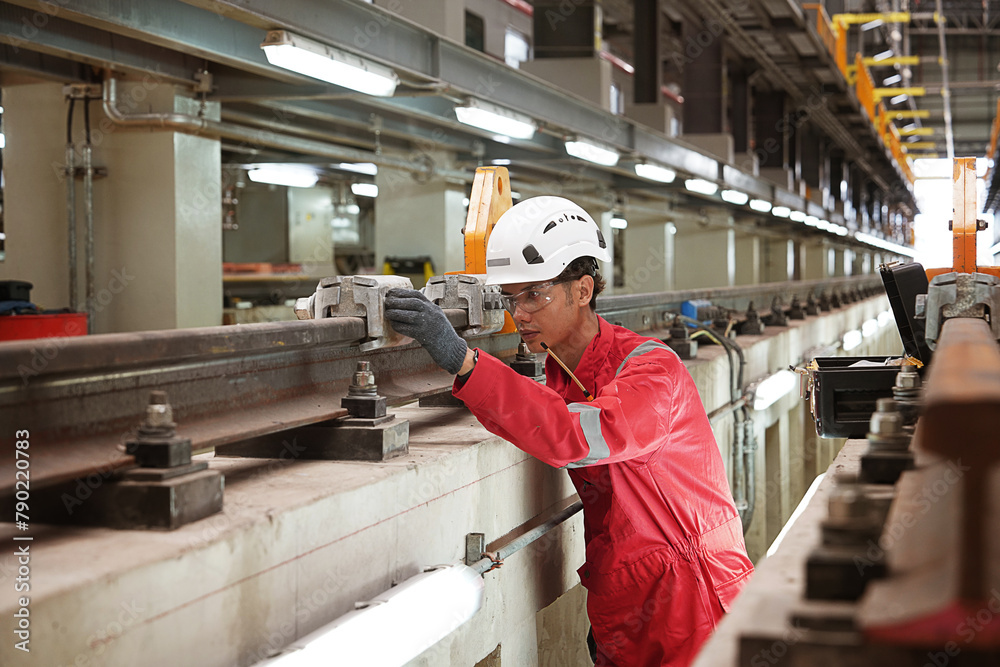 lectric train engineer employees are maintenance technicians, wearing ...