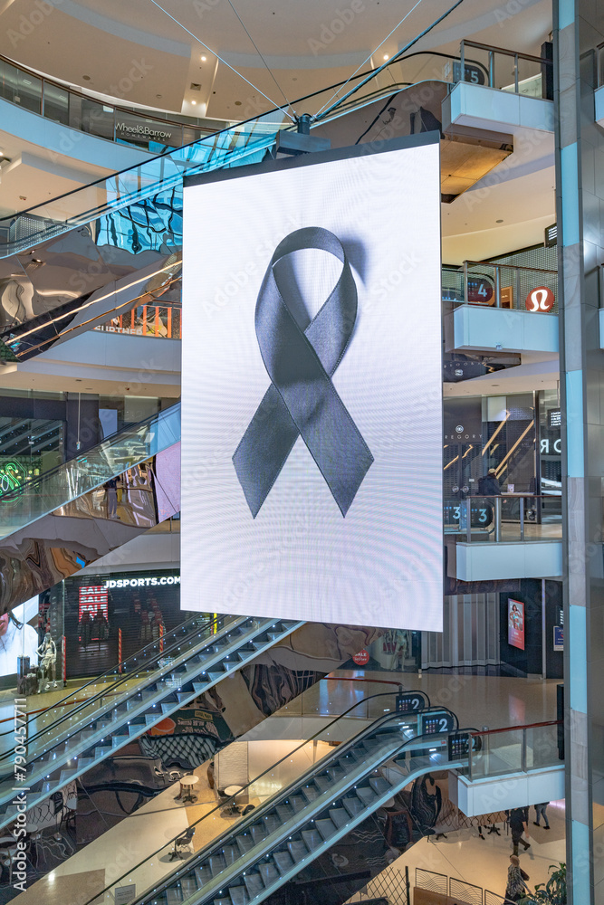 Large digital display showing a black ribbon inside Westfield at Bondi ...
