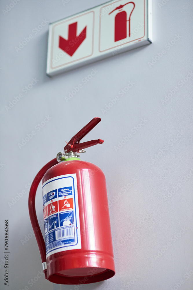 Fire extinguisher, wall and sign for firefighting, action and safety ...