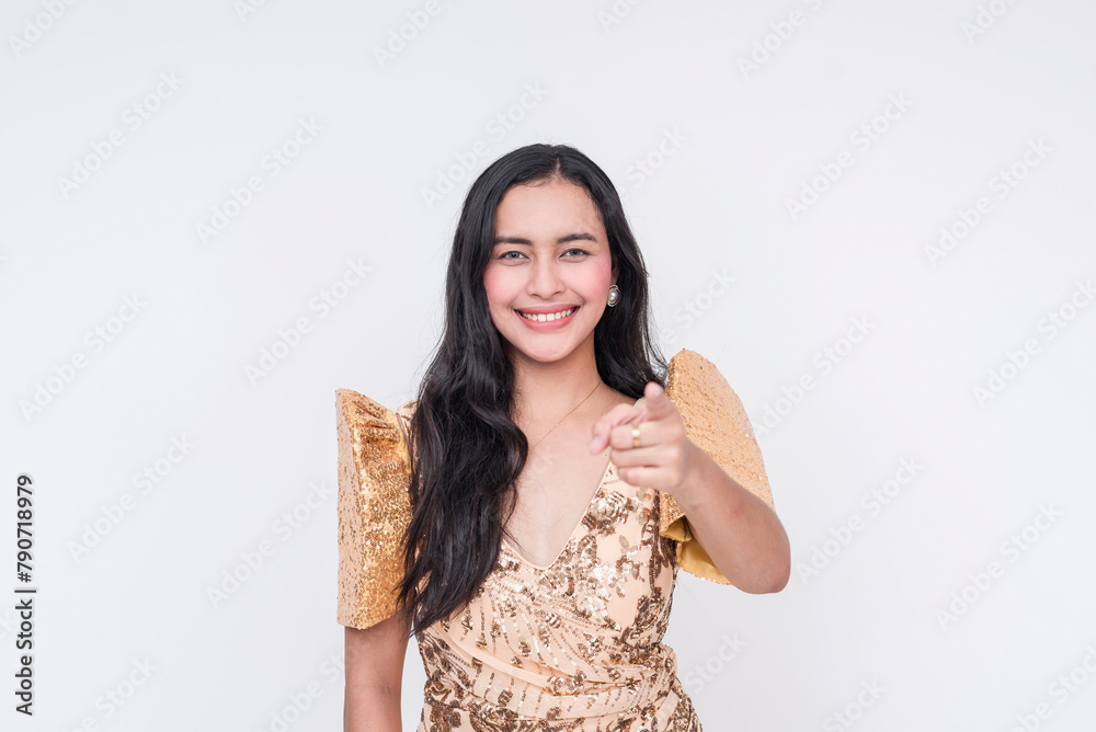 Filipina woman in traditional Filipiniana dress pointing forward ...