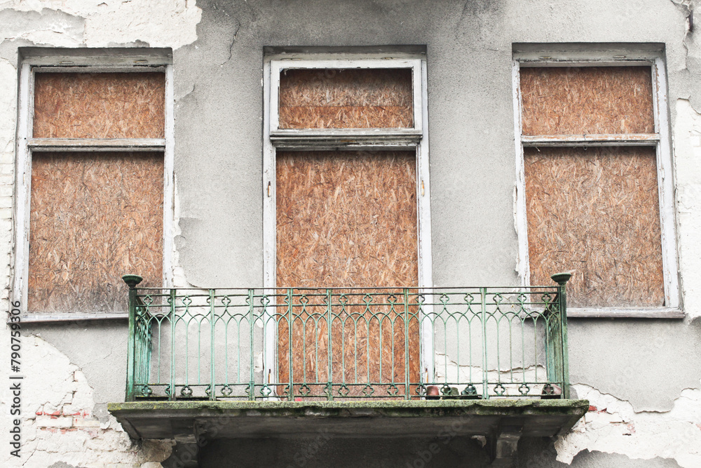 Tenement building balcony. Brick wall cracked facade. Old architecture ...