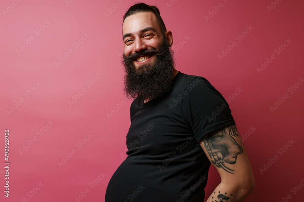 Pregnant transexual man with beard expectant trans father on bright ...