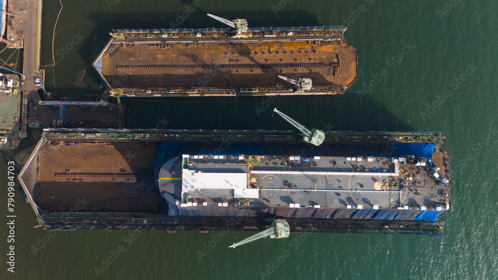 Dry dock with Cargo Ship maintenance or repair at floating dock in ...