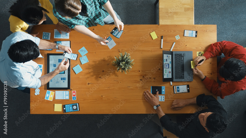 Programmer sharing Ux Ui design for mobile phone interface idea with software developer at ...