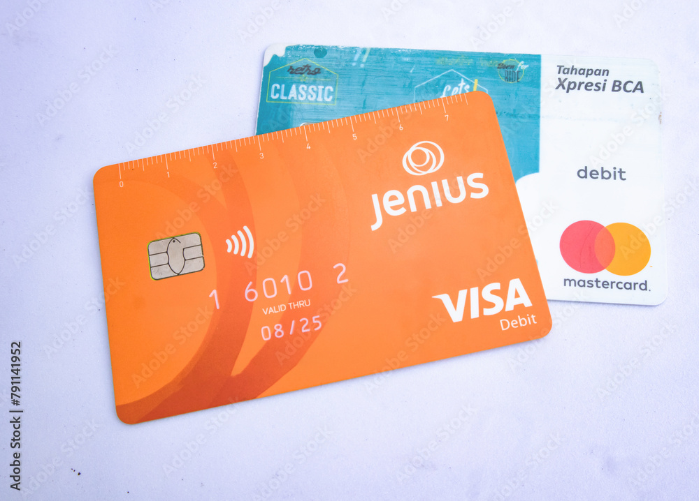 Bank Jenius and BCA ATM cards with white background on April 26, 2024 ...