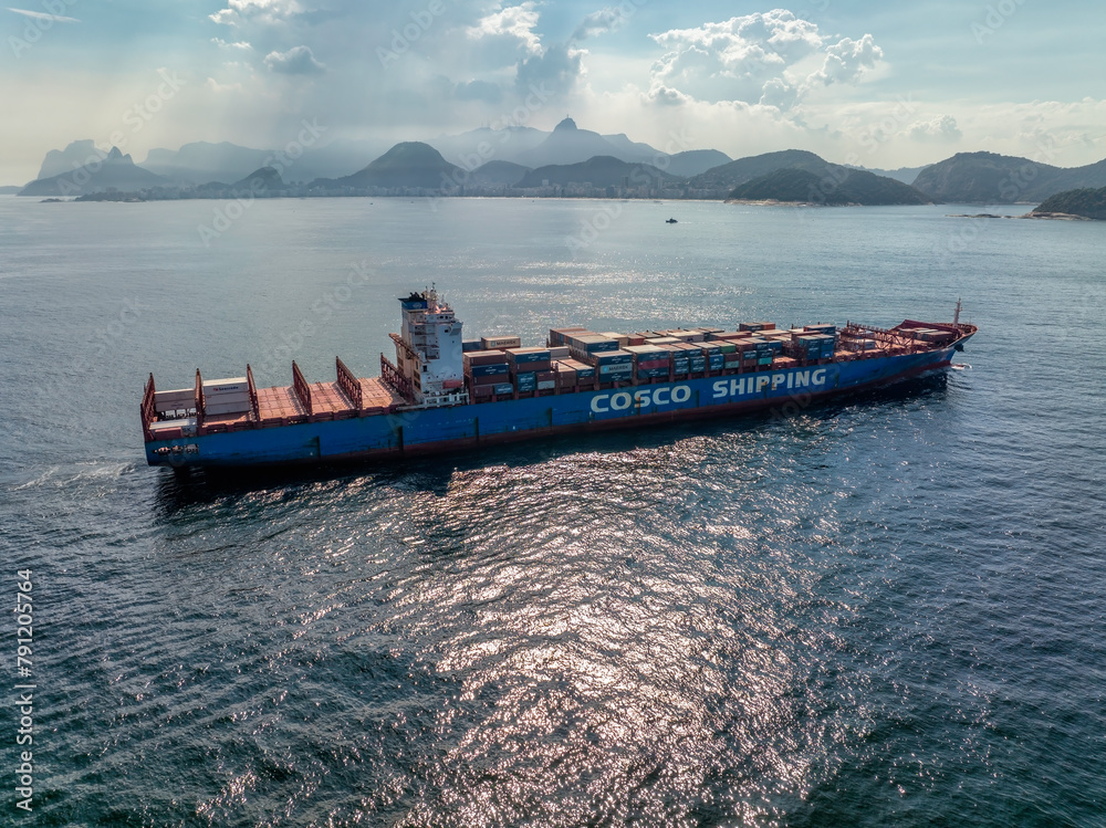Cosco Shipping container ship on open water with panorama of Rio de ...