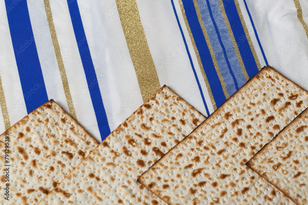 Matzah, a traditional unleavened bread, on a Tallit, a Jewish prayer ...