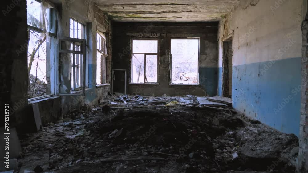 The dilapidated interior of an abandoned building, littered with ...