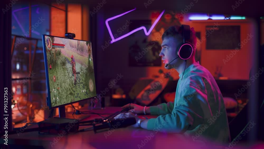 Young Professional Gamer Playing in Fantasy Video Game, Engaged In ...