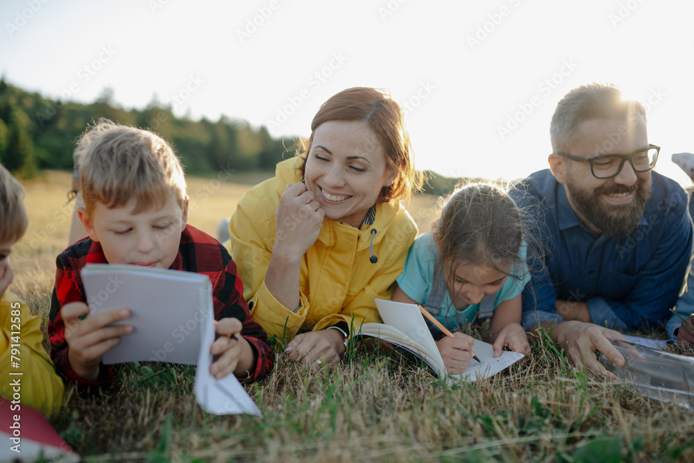 Young students learning about nature, forest ecosystem during biology ...
