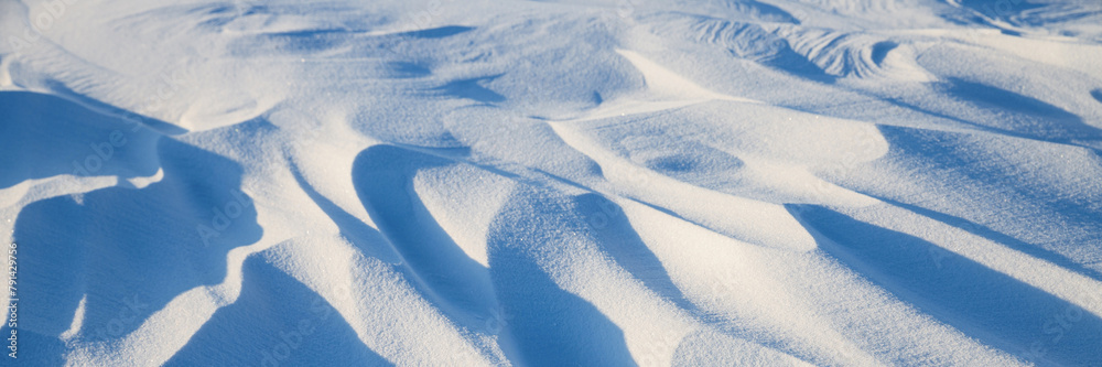 Snow texture. Wind sculpted patterns on snow surface. Wind in the ...