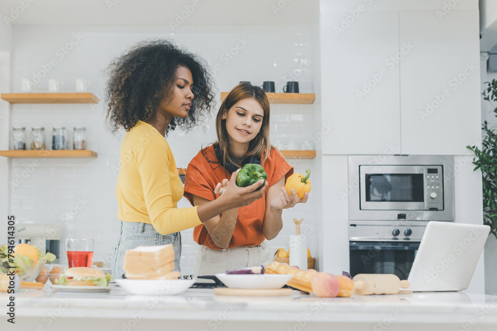 Pride LGBT Family at the kitchen Happy face. Preparing family dinner at ...