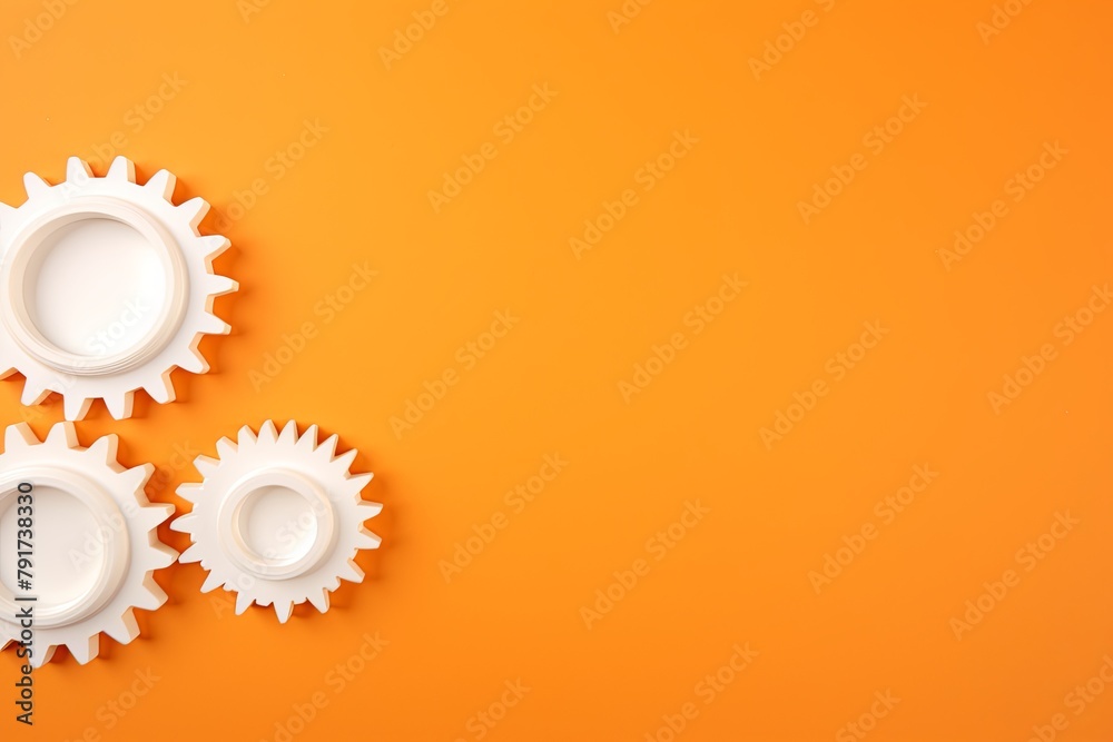 Three white gears on a Orange background, laid flat, copy space concept ...