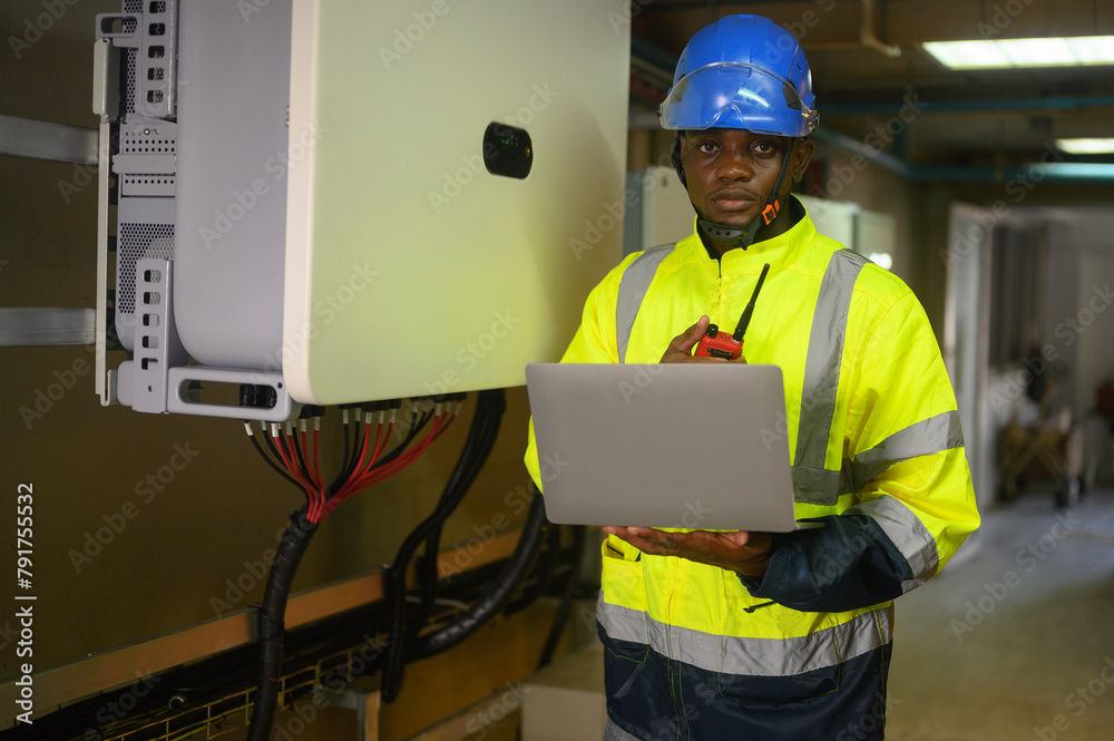 engineering technician Setting up the solar panel inverter in the ...