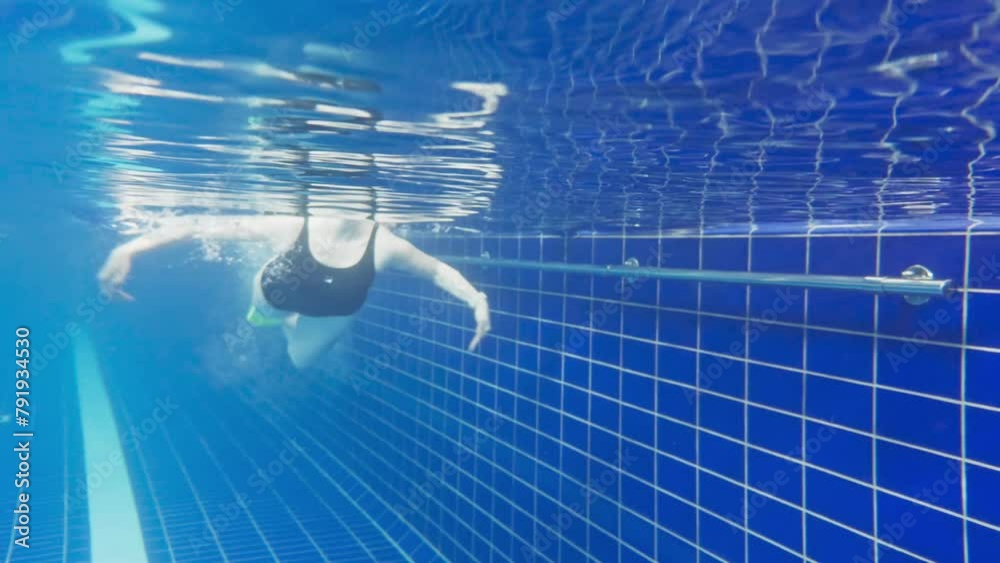 Under water view of professional female swimmer. Woman athlete swimmer ...
