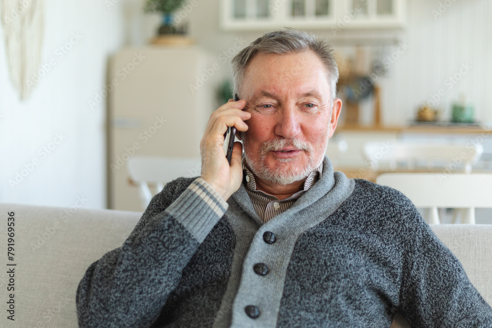 Happy middle aged senior man talking on smartphone with family friends ...