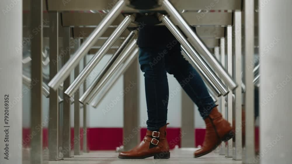 Low angle view unrecognizable female passenger going through steel ...