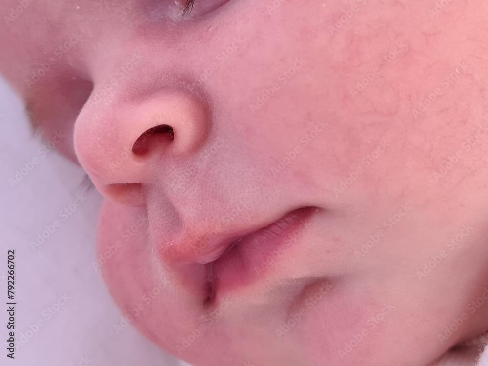 the baby's face where only the lips and nose are visible Stock Photo ...