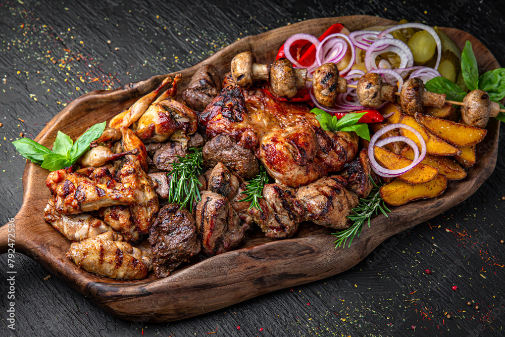 Meat set for a large group. A dish of different types of meat: beef ...