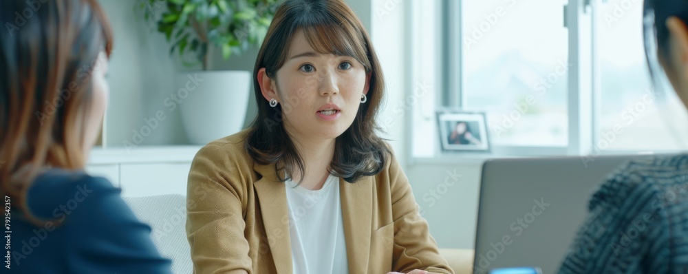 Japanese asian woman in her thirties is having an interview with ...