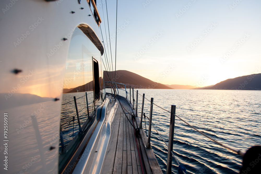 Yacht sailing at sea at sunset. Traveling with amazing view and ...