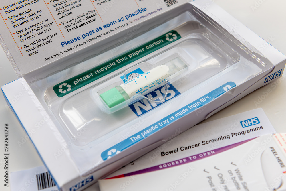 London. UK- 04.17.2024. The open box and contains of a NHS bowel cancer ...