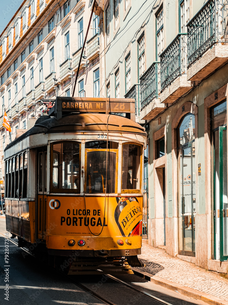 One of Lisbons famous tram 28 taking riders on a 40-minute trip up (or ...