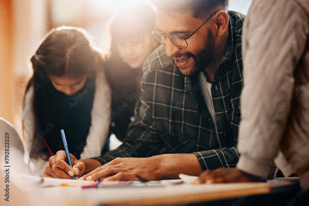 Drawing class in primary school. Teacher shows his students how to use ...