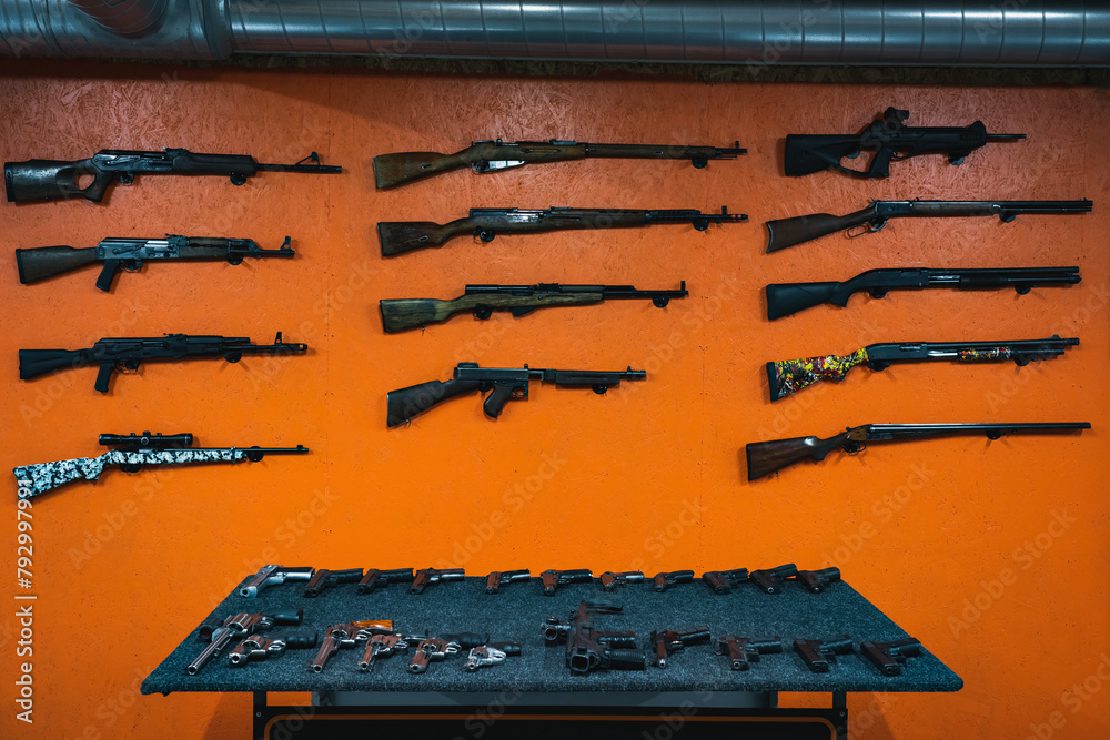 Firearms, rifles, pistol, revolvers and shotguns in a shooting range ...