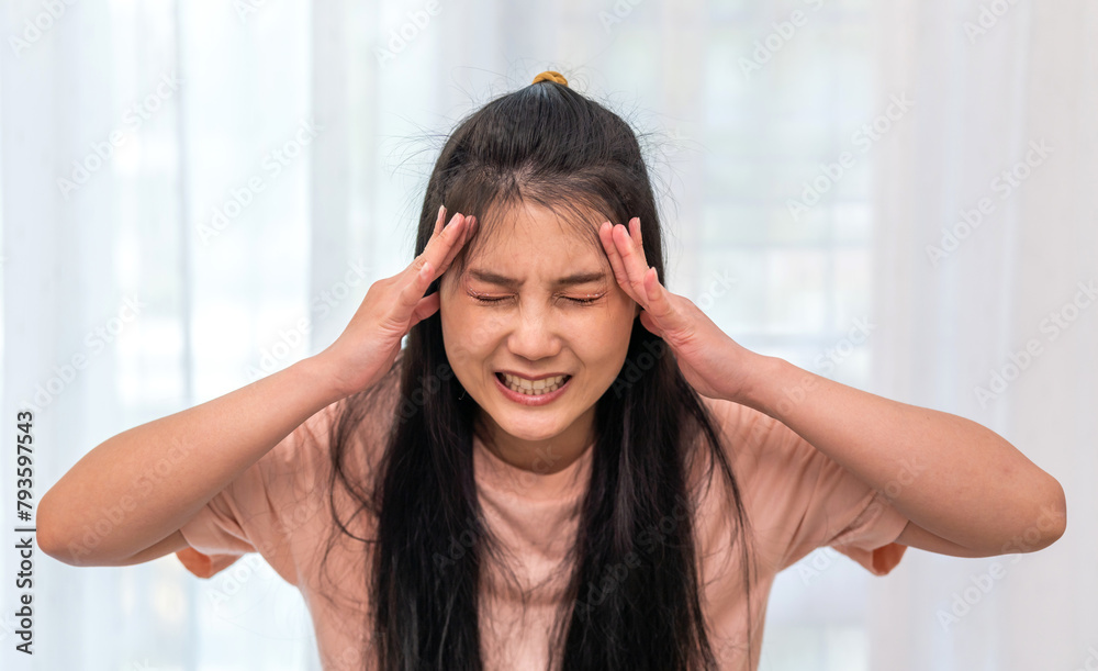 Asian woman holding and touching on head feel suffering head ache pain ...