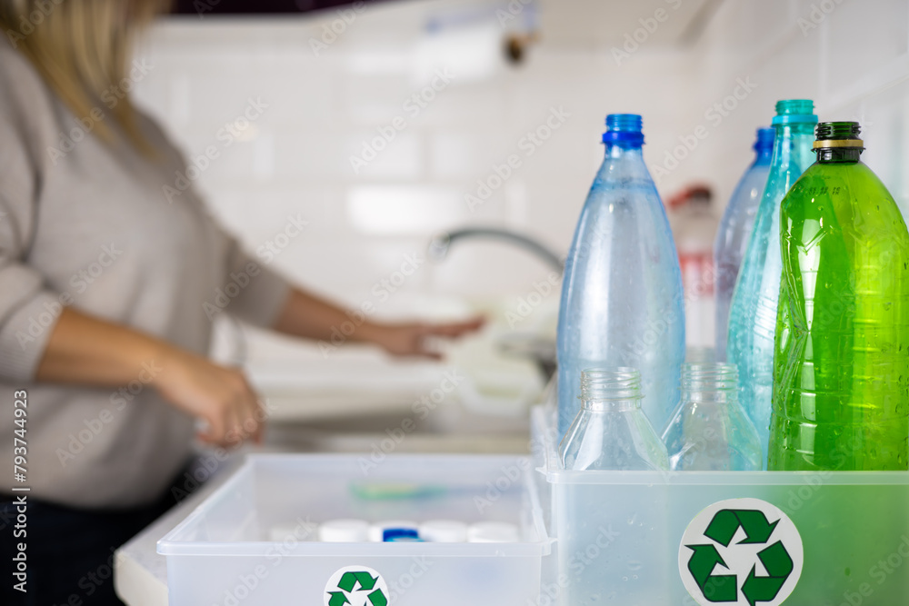 Sorting plastic for recycling. Zero waste. A female eco activist is ...