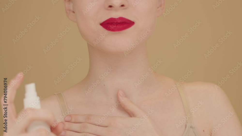 Slow motion Beautiful Caucasian woman with red lips using moisturising ...