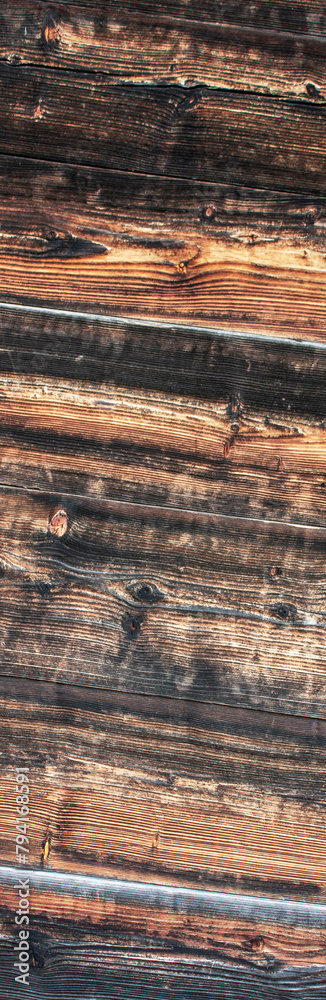 Fragment of the cladding of an old house made of boards. Diagonal ...