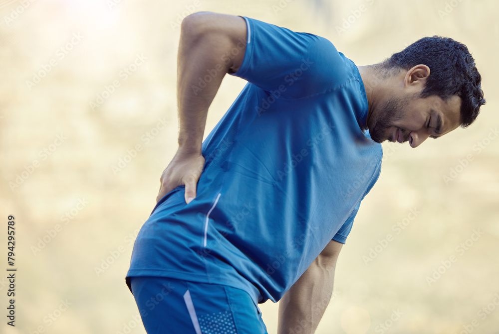 Man, exercise and back pain or outdoor workout with pressure ...