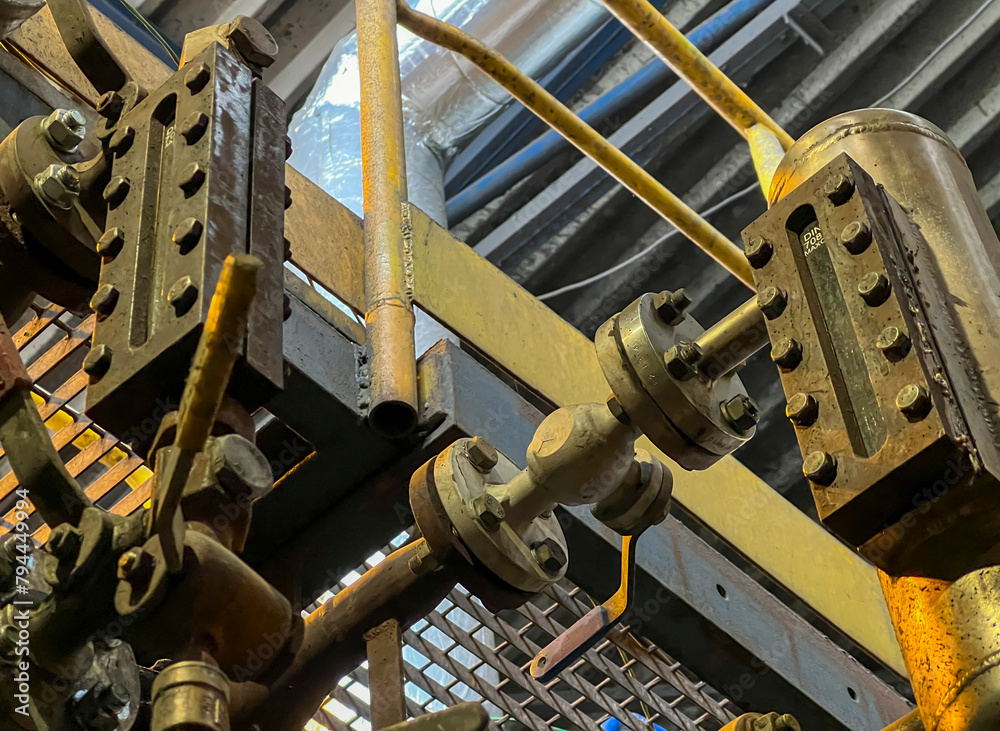 Valves and other safety equipment on an old steam boiler. Extensive ...