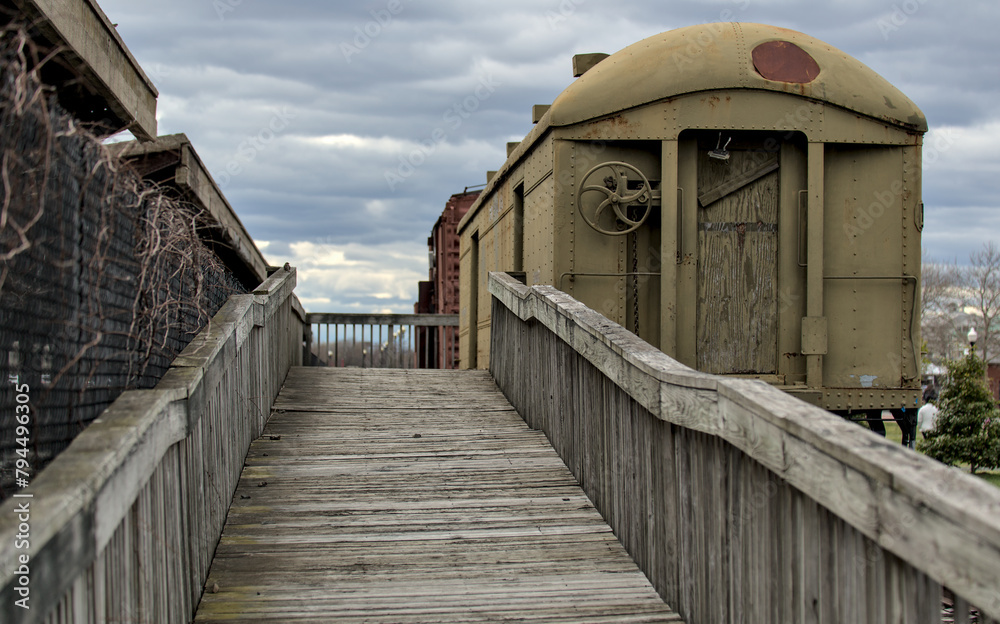 old rusty railroad train car next to wooden ramp (abandoned antique ...
