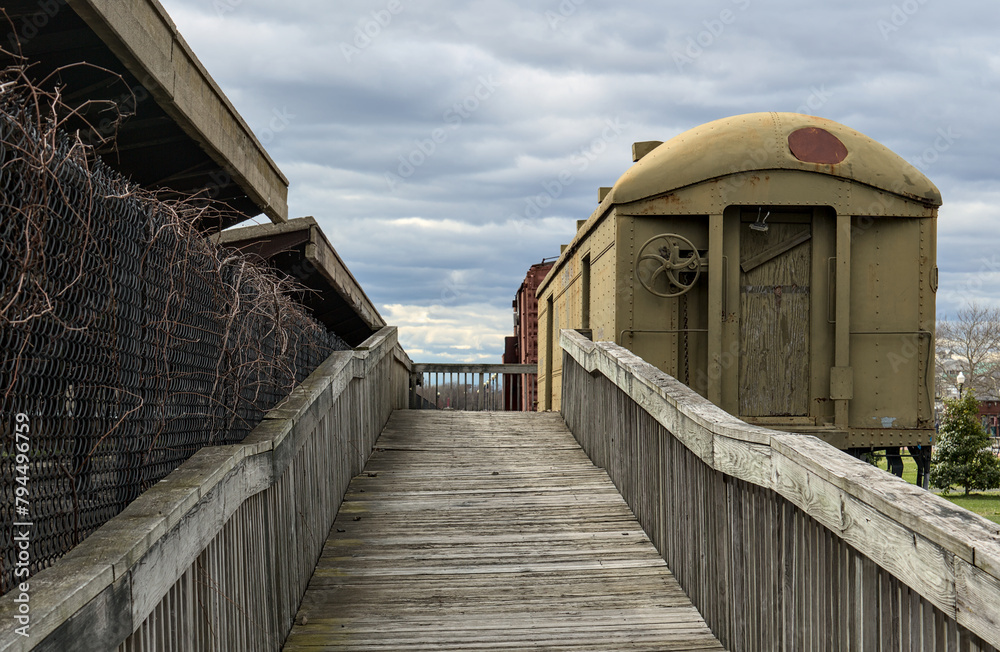old rusty railroad train car next to wooden ramp (abandoned antique ...