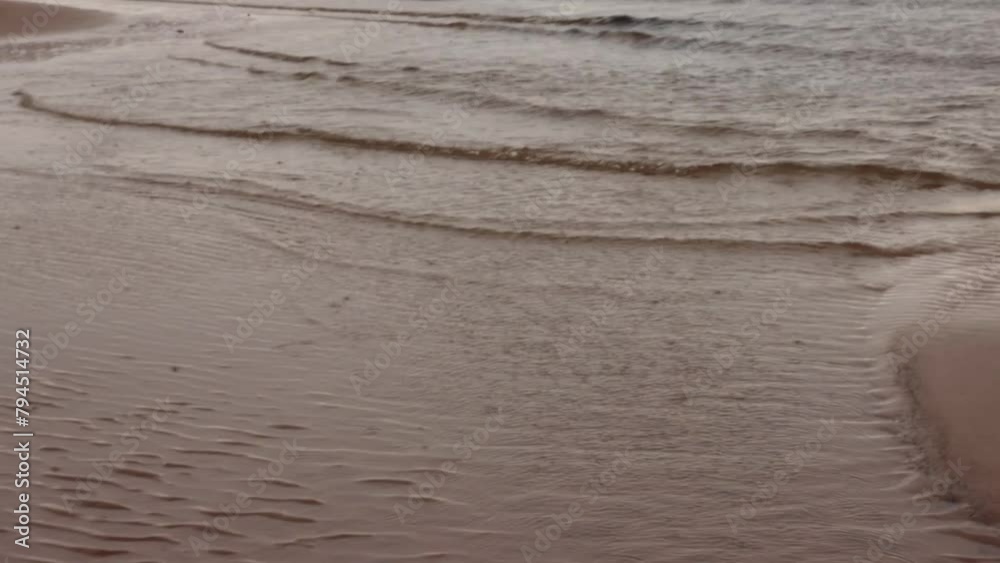 Vidéo Stock Closeup of sand sea bottom with little waves floating to ...