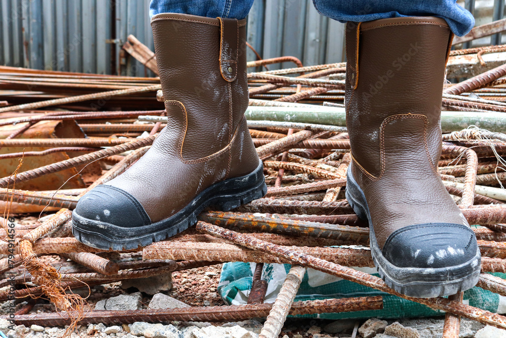 Photo of brown leather safety boots worn by a construction worker to ...
