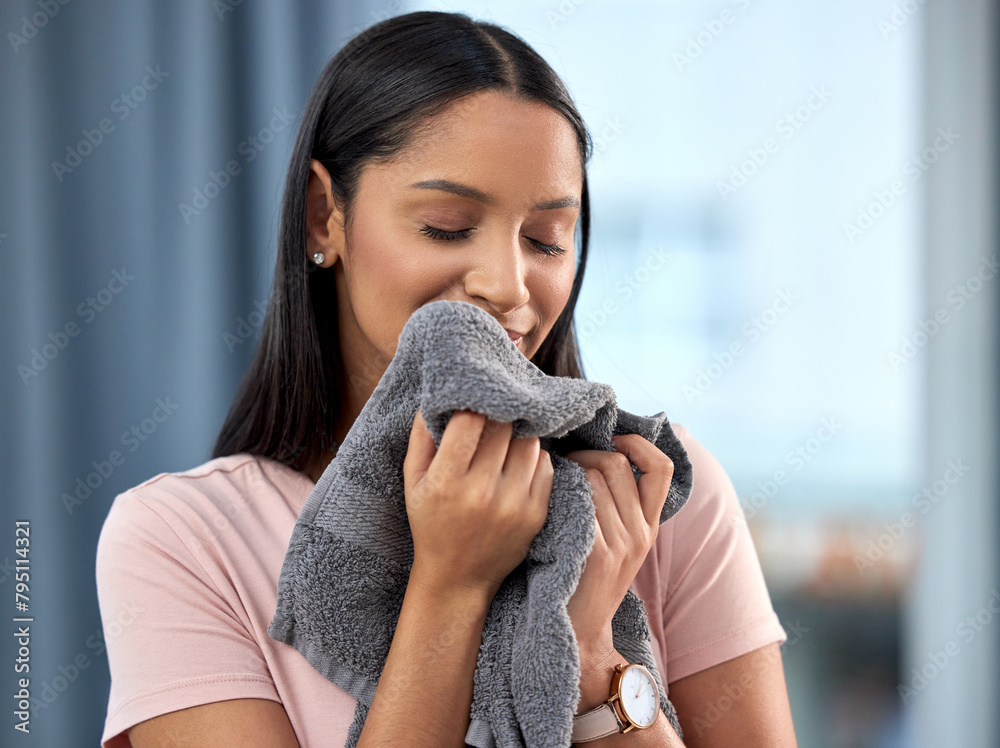 Laundry, fresh linen and woman smelling towel after spring cleaning ...