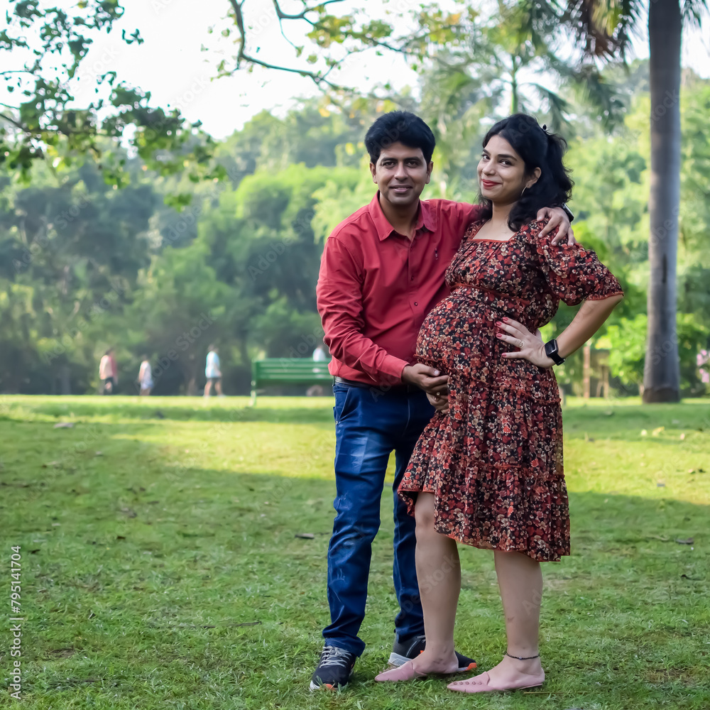 Indian couple posing for Maternity shoot pose for welcoming new born ...