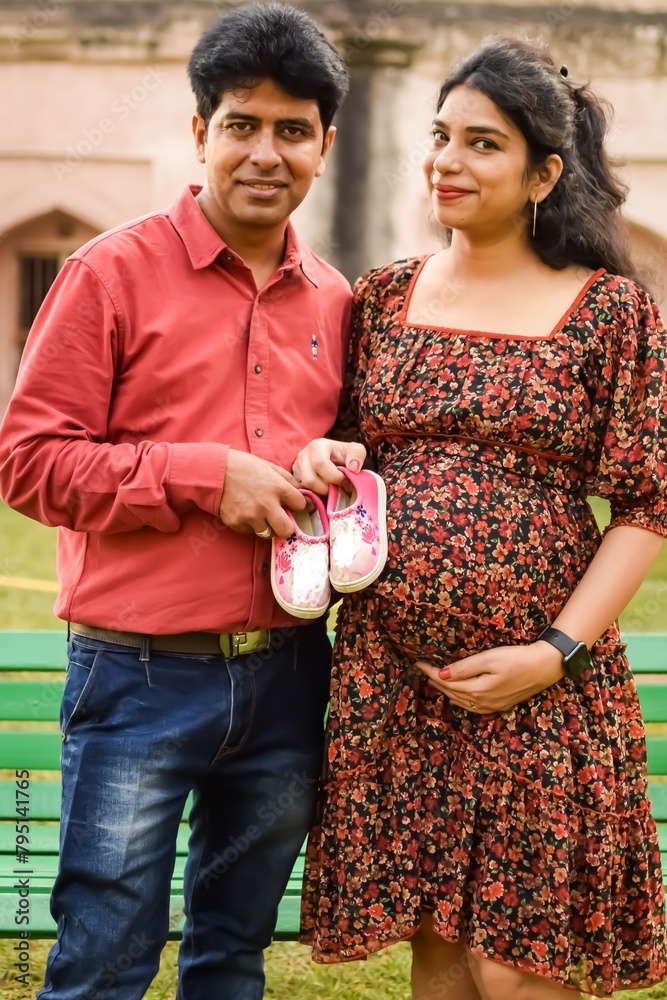 Indian couple posing for Maternity shoot pose for welcoming new born ...