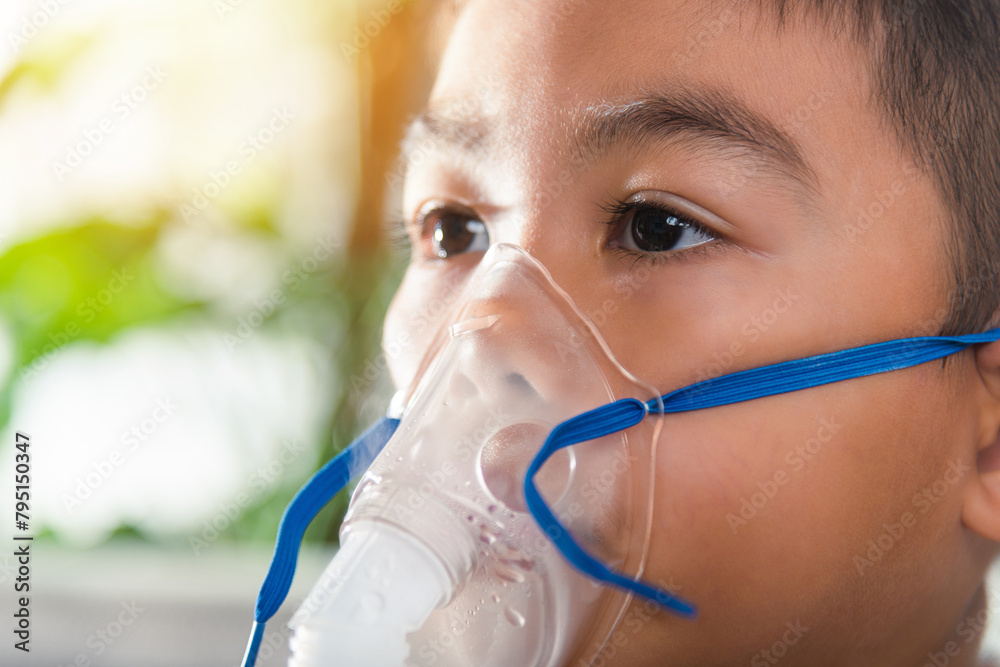 Asian Child using nebulizer mask equipment alone have smoke, Kid boy ...