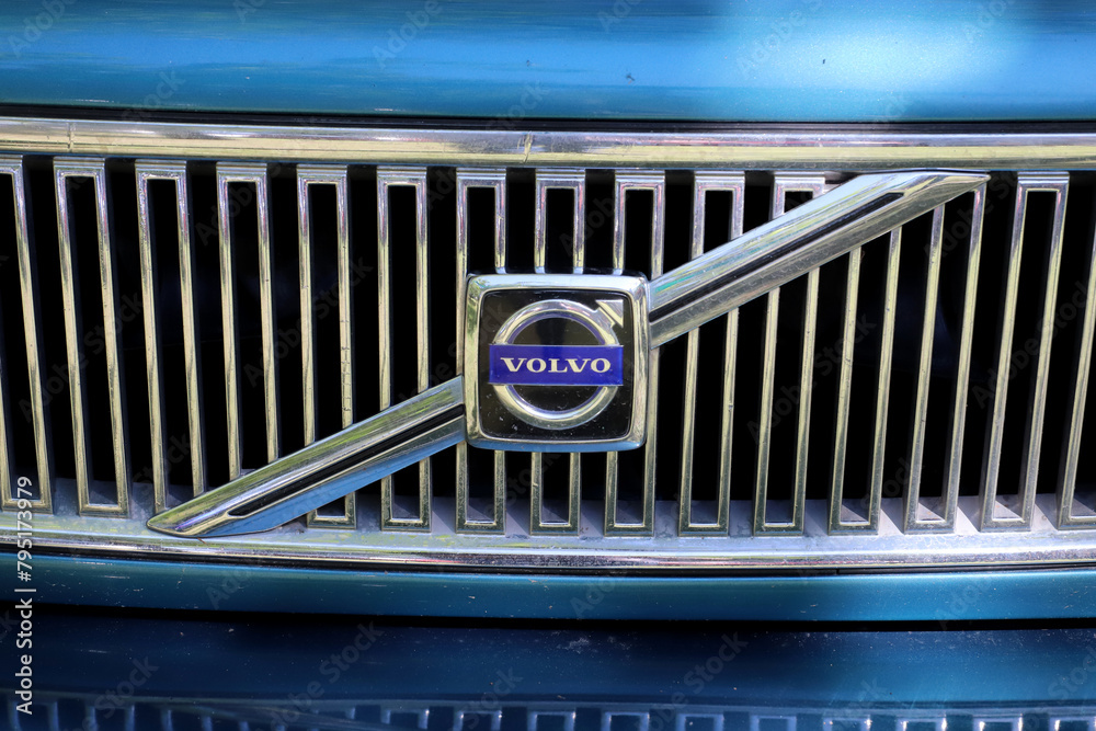 Detail of grill and classic blue Volvo car. Volvo logo. Outdoor ...
