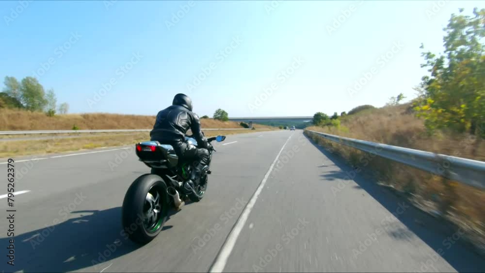 Follow to motorcyclist riding on modern sport motorbike at highway ...