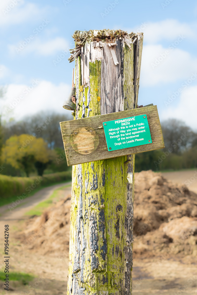 Old rustic Permissive path sign post showing the public that there is ...